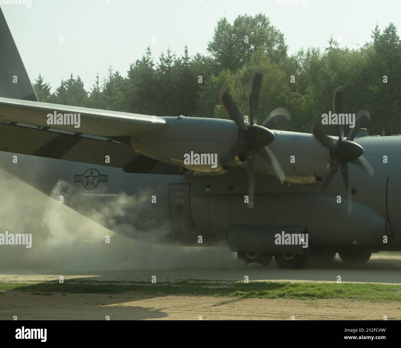 A C-130 Hercules lands to supply U.S. Army paratroopers assigned to the ...