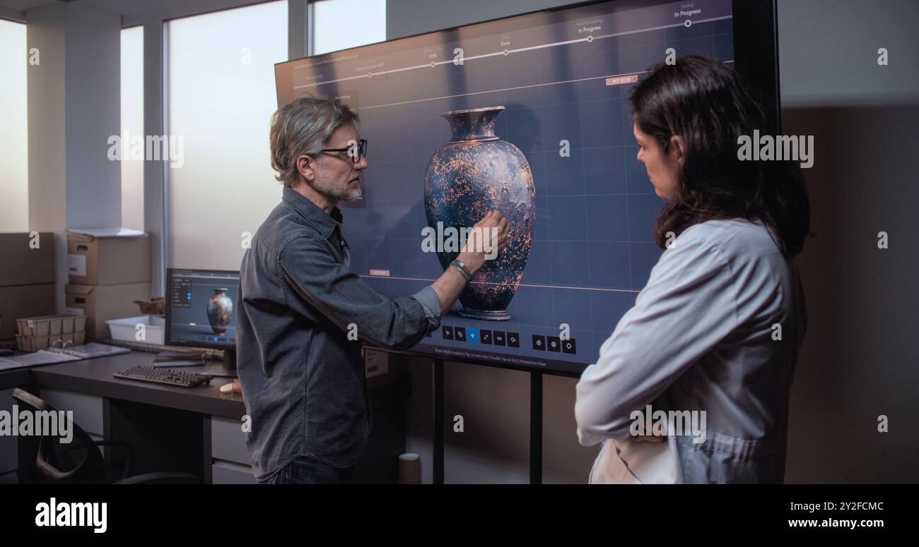 Male female scientists discuss three hi-res stock photography and ...