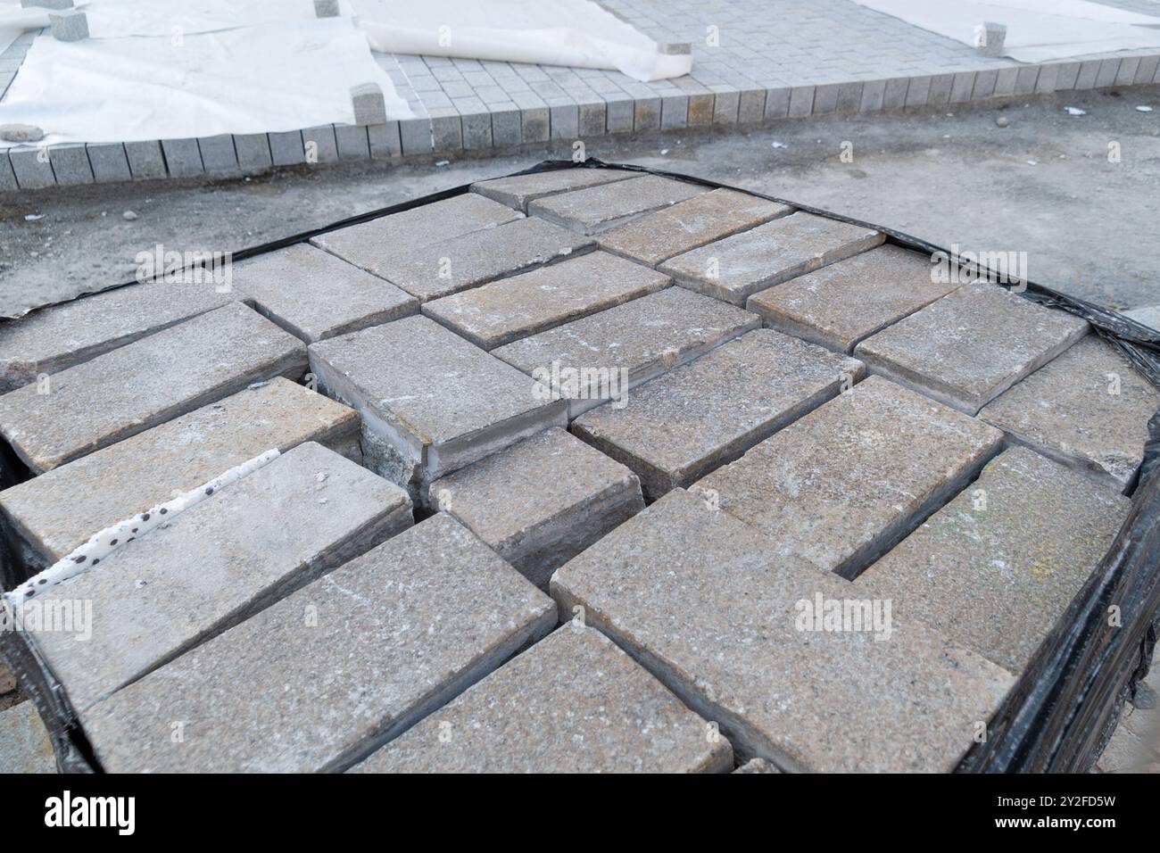 A pile of old concrete slabs. Replacing paving stones. Construction ...