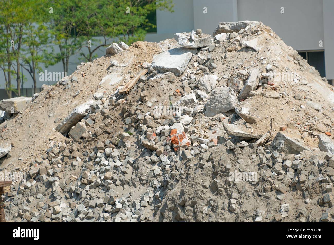 A pile of construction waste on a construction site. Stones, concrete ...