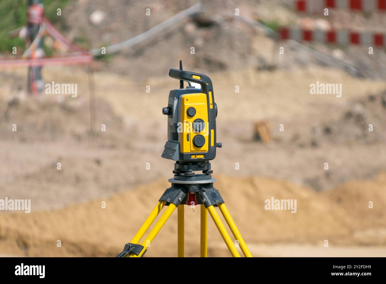 A surveying instrument for measuring distances on a construction site ...