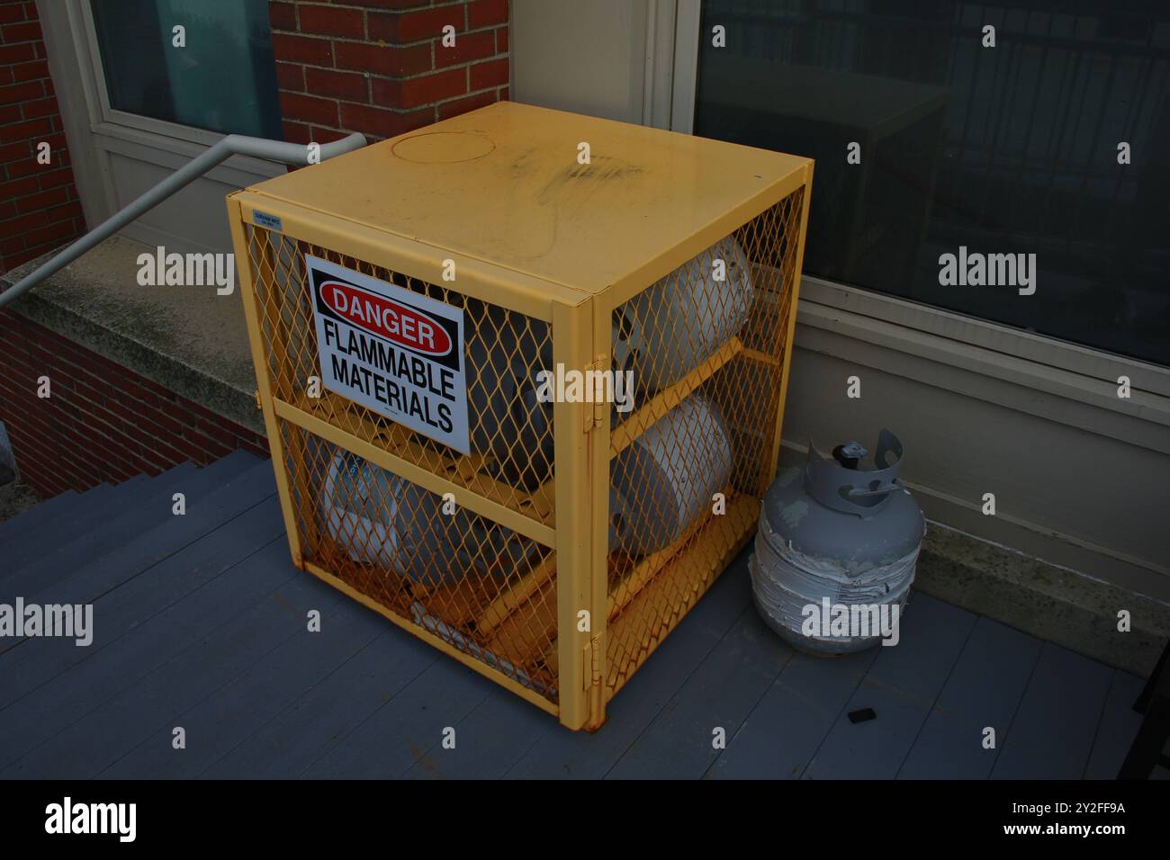 propane tanks in a safety cage Stock Photo - Alamy