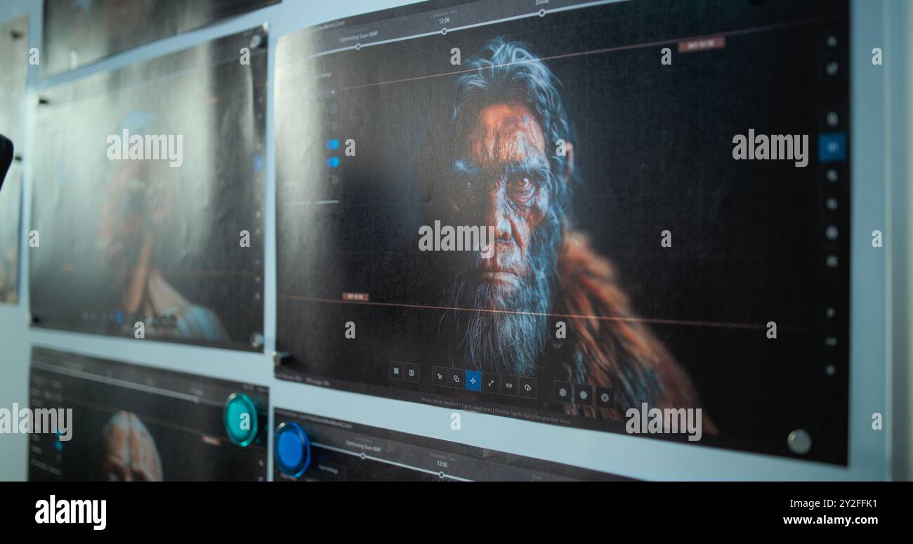 Board with printed images of 3D model of ancient human head. Three ...