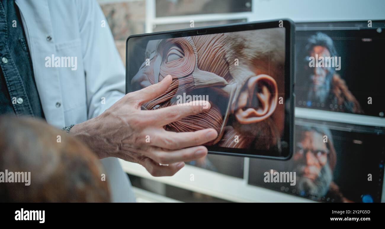 Archaeologists study anatomy of fossil skull using tablet computer with ...