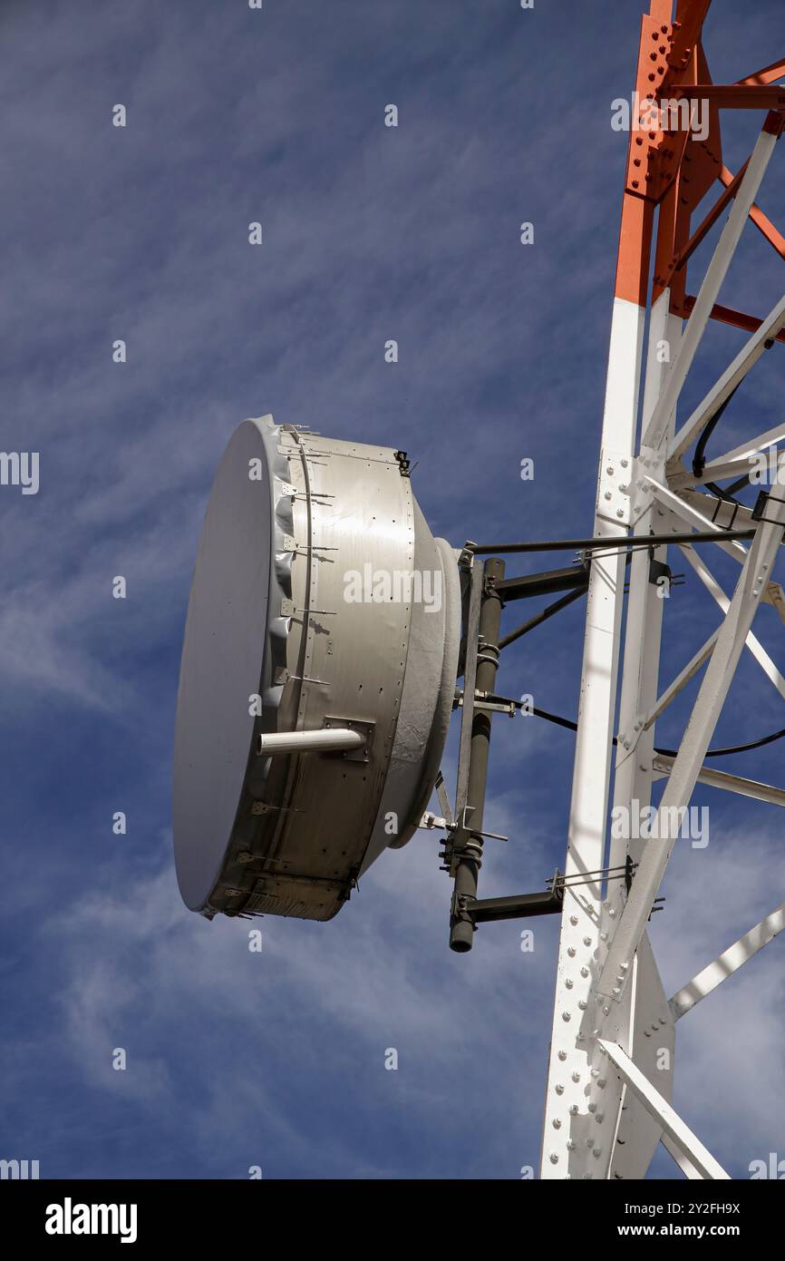 Detailed image of part of an old communications tower with antenna in a ...