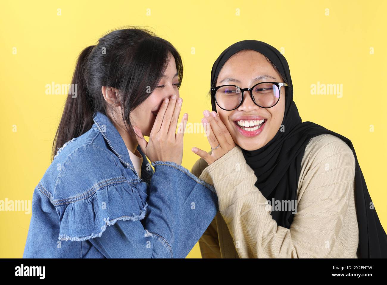 Two Young Asian Indonesian Women, Hand on Mouth Telling Gossip Secret ...