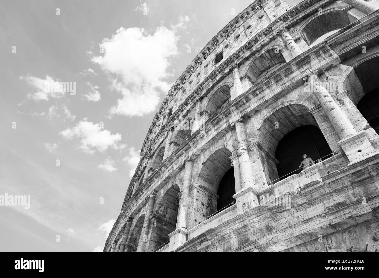 Visitors admire the grandeur of the Colosseum in Rome, Italy, capturing ...