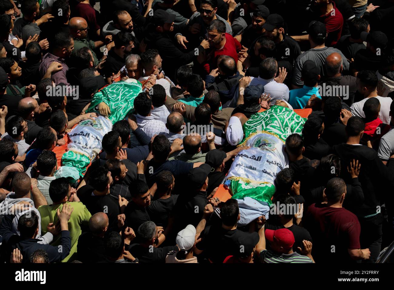 West Bank, Palestine. 04 May 2023. Mourners carry the body of three ...