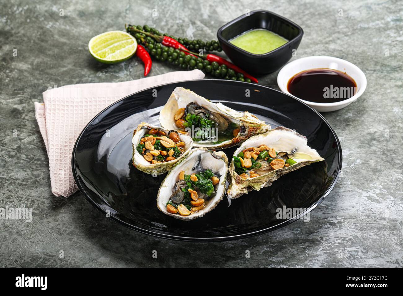 Open half oysters with green onion and peanut Stock Photo - Alamy