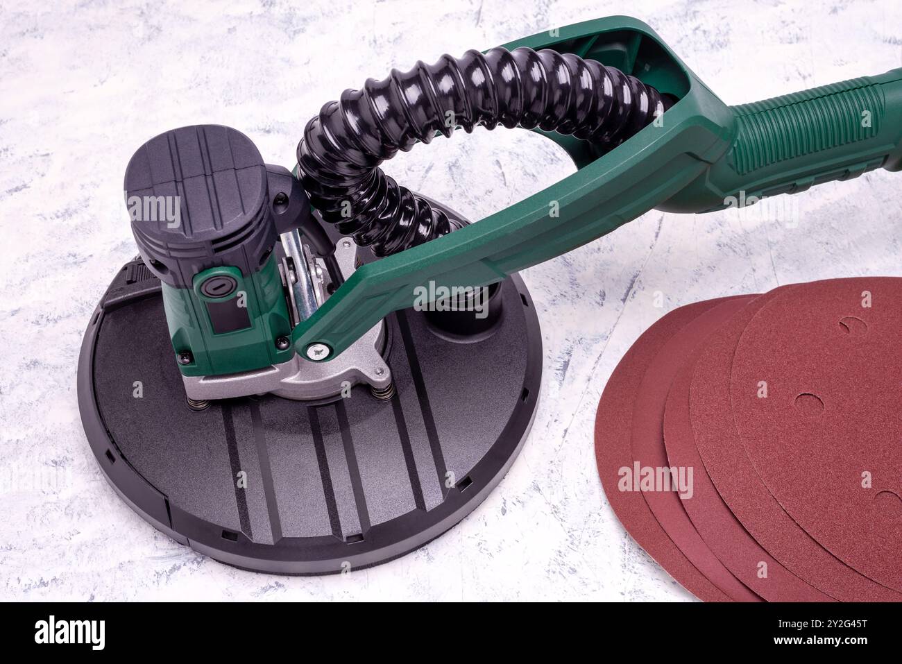 Wall grinder with telescopic handle and sandpaper for smoothing and ...