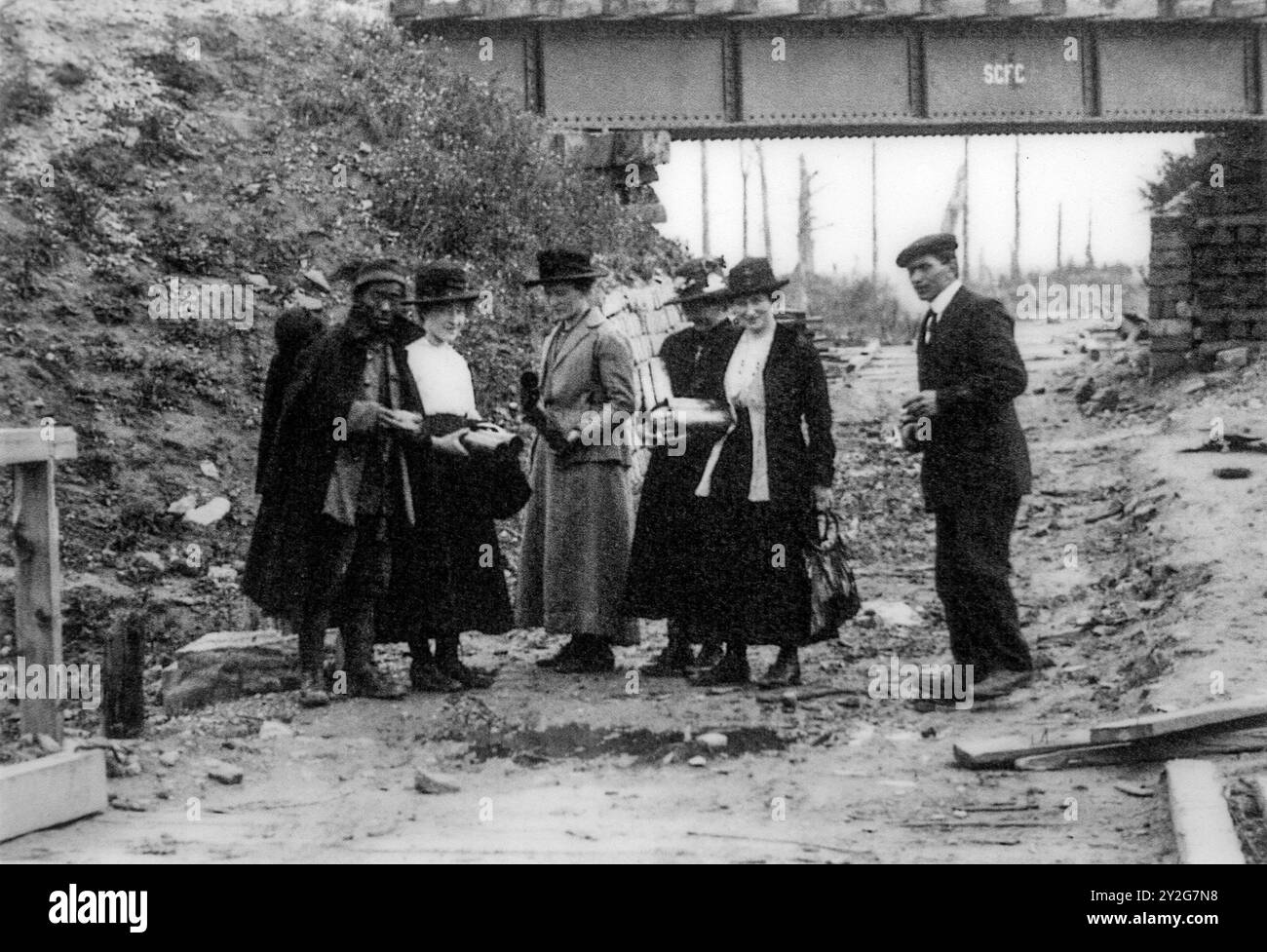Belgian WWI battlefield tourists buying souvenirs from labourer of ...
