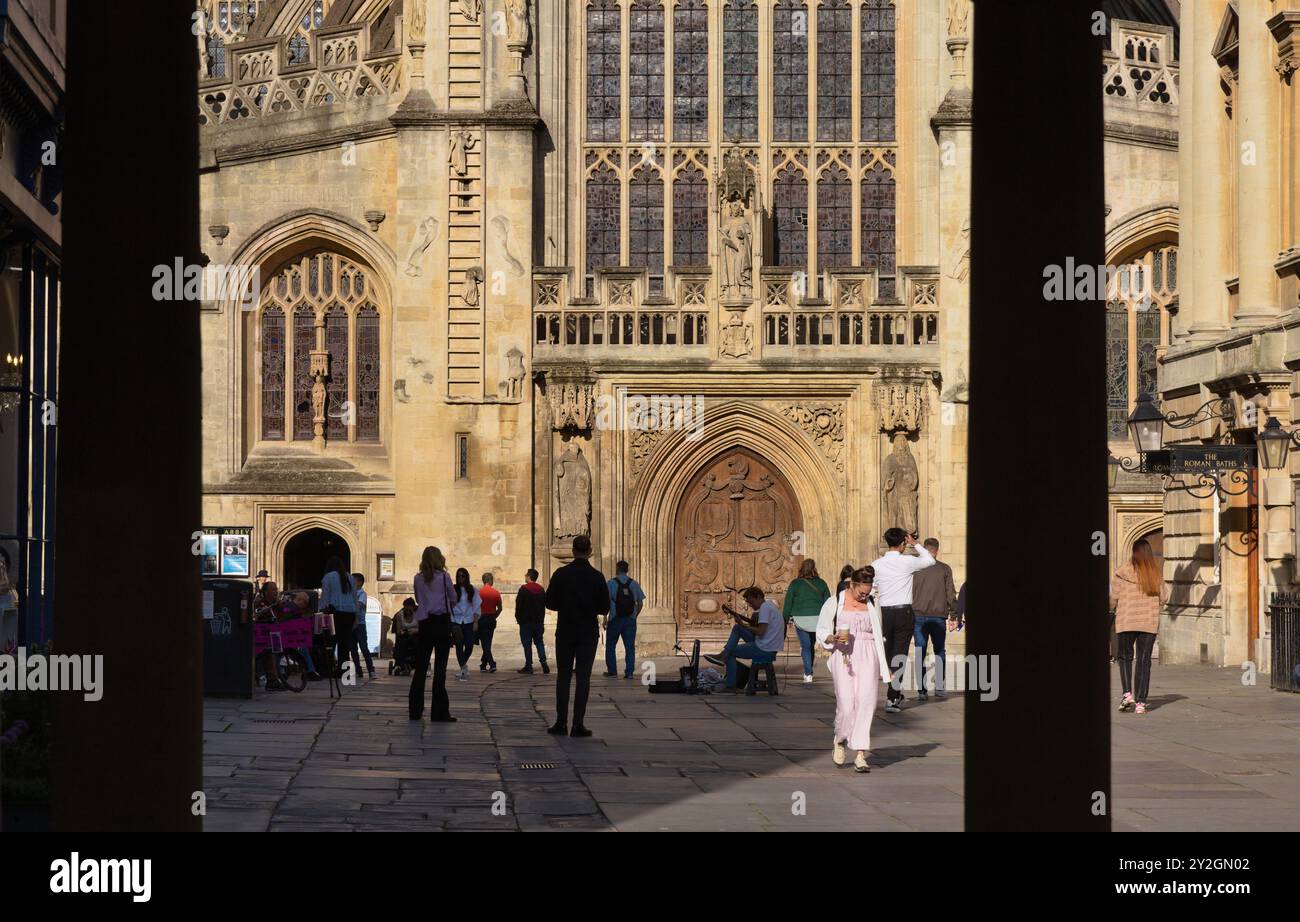 A Scene With A Street Musician And Tourists In Front Of The Famous Bath ...