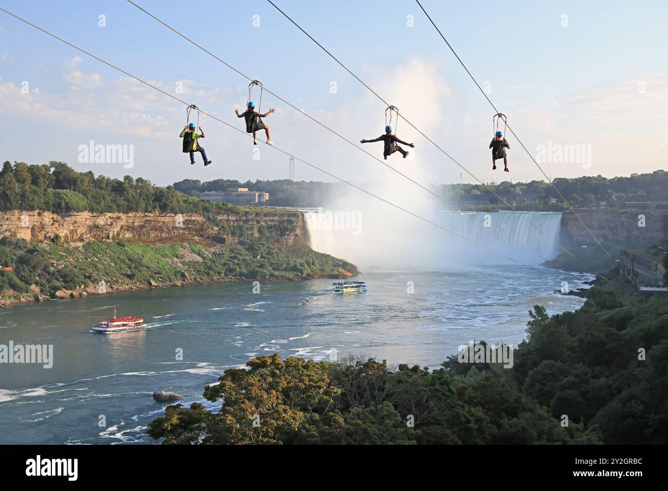 Tourists enjoying zipline ride at Niagara Falls in summer, Canada Stock ...