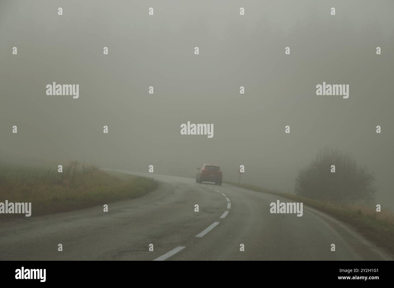 driving on dangerous road in mist and haze Stock Photo - Alamy