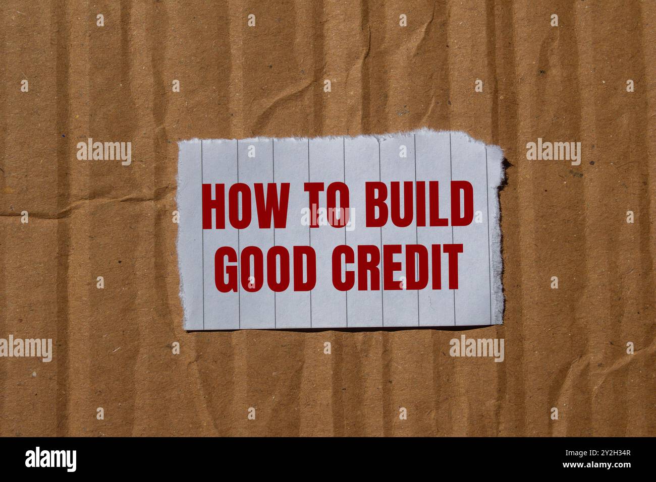 How to build good credit message written on ripped torn paper with ...