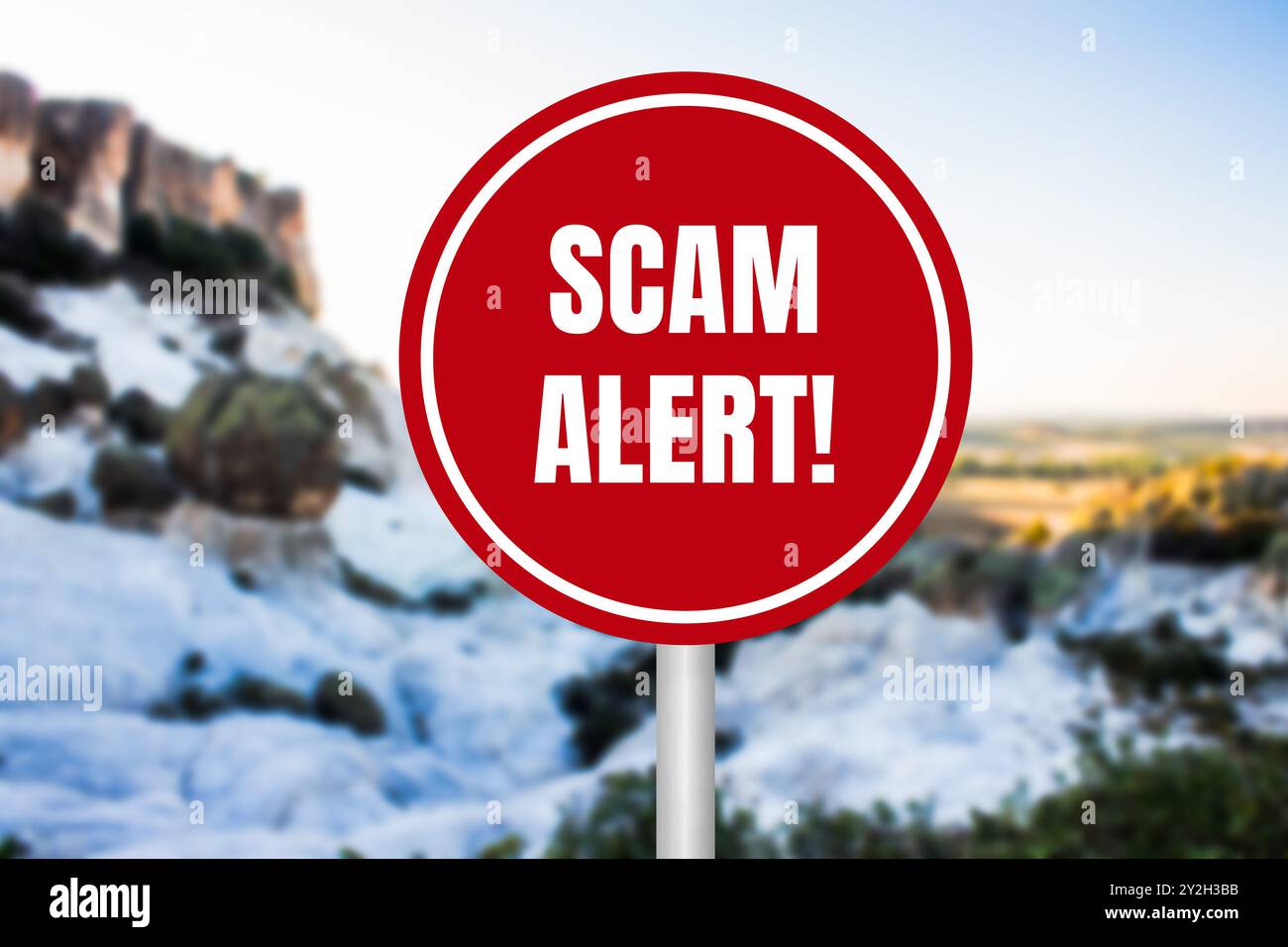 Scam alert message written on red round sign on nature background ...
