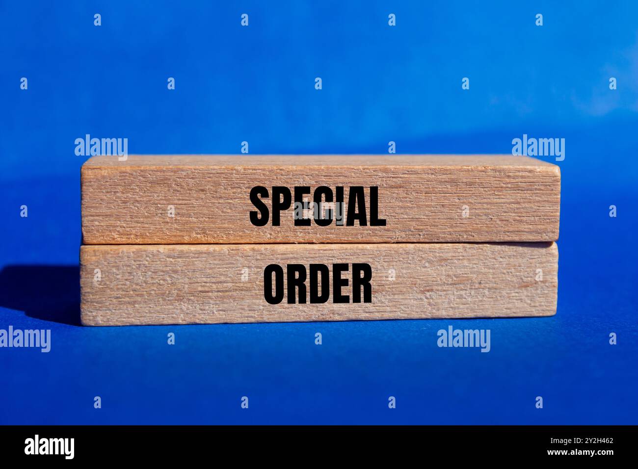 Special order message written on wooden blocks with blue background ...