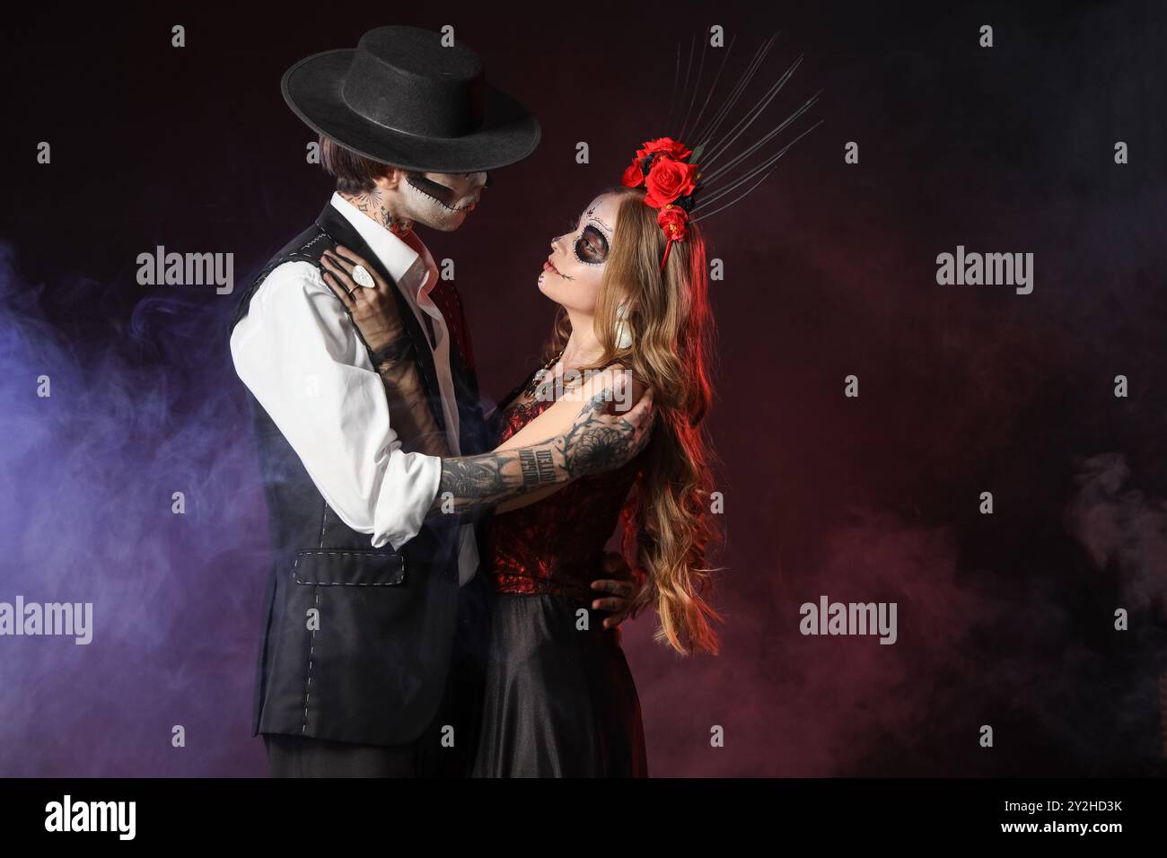 Young couple dressed for Mexico's Day of the Dead (El Dia de Muertos ...