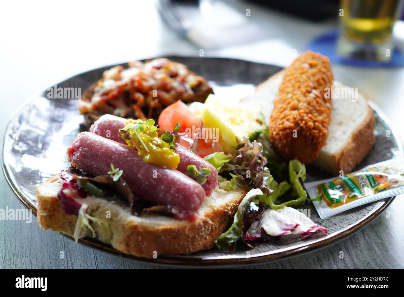 Dutch specialty croquettes (Kroket)and sausage on toast Stock Photo - Alamy