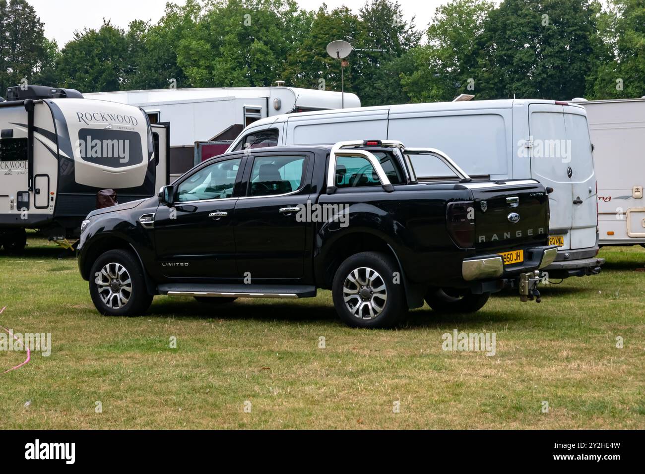 Black Ford Ranger limited edition pick-up truck parked on a grass field ...