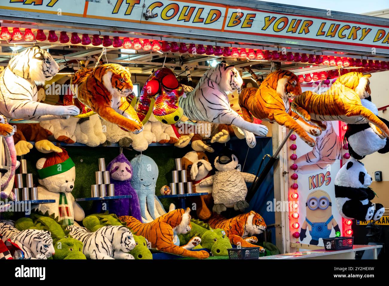 Stuffed animal soft toys as prizes on a stall at a travelling funfair ...