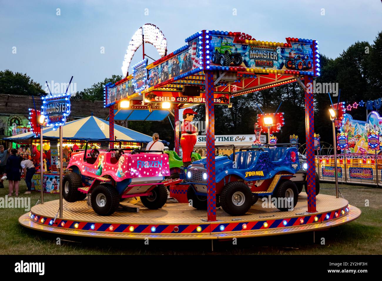 Monster trucks carousel ride at a travelling funfair in Saffron Walden ...