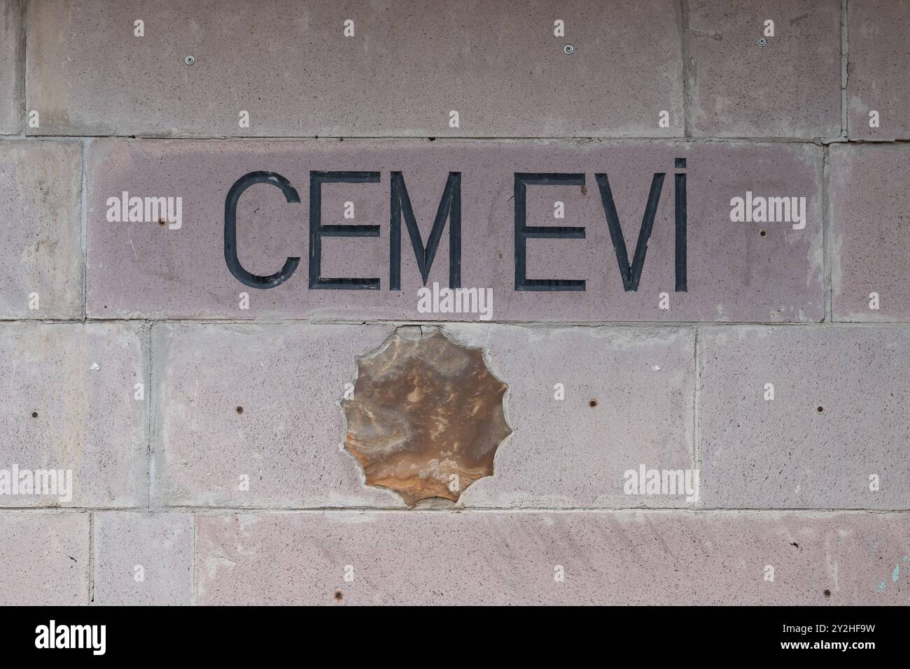 Cem evi sign on the building wall. Cem evi "a house of gathering" in ...