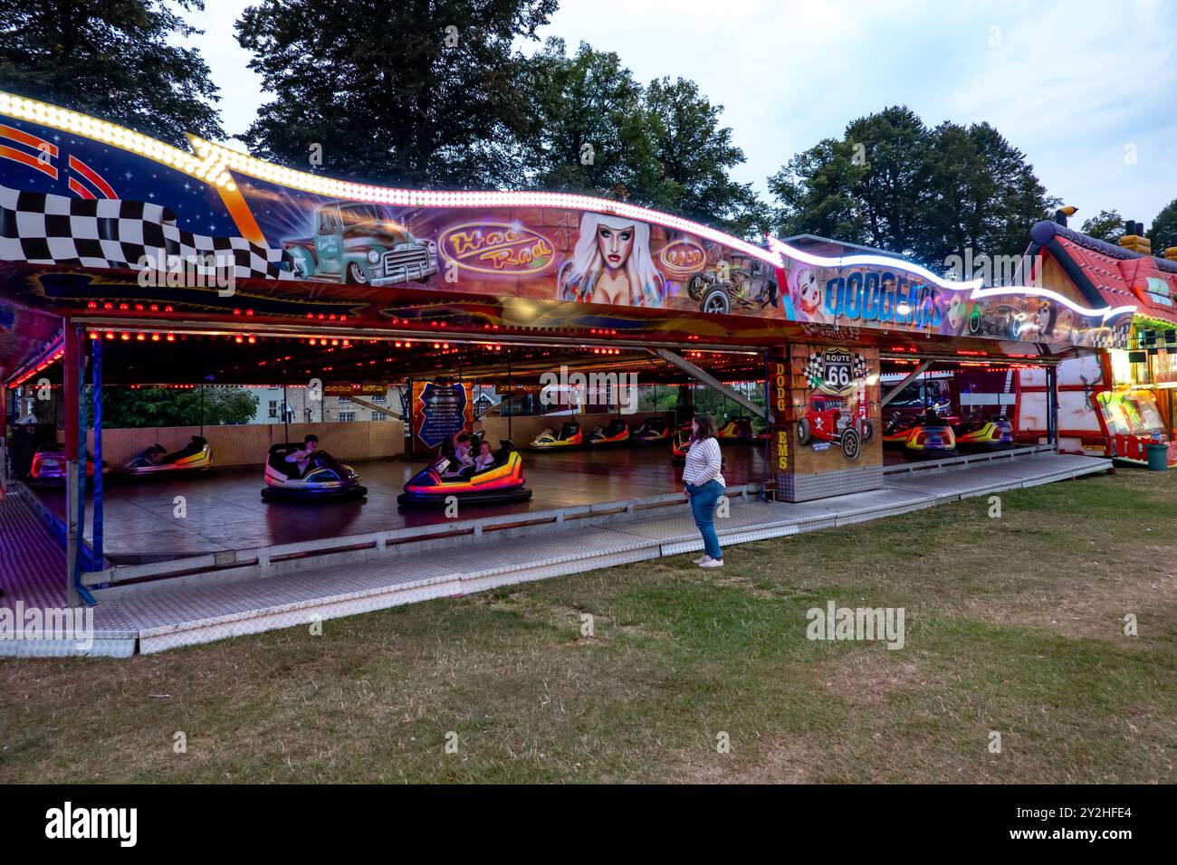 People enjoying dodgems bumper cars at a travelling funfair in Saffron ...
