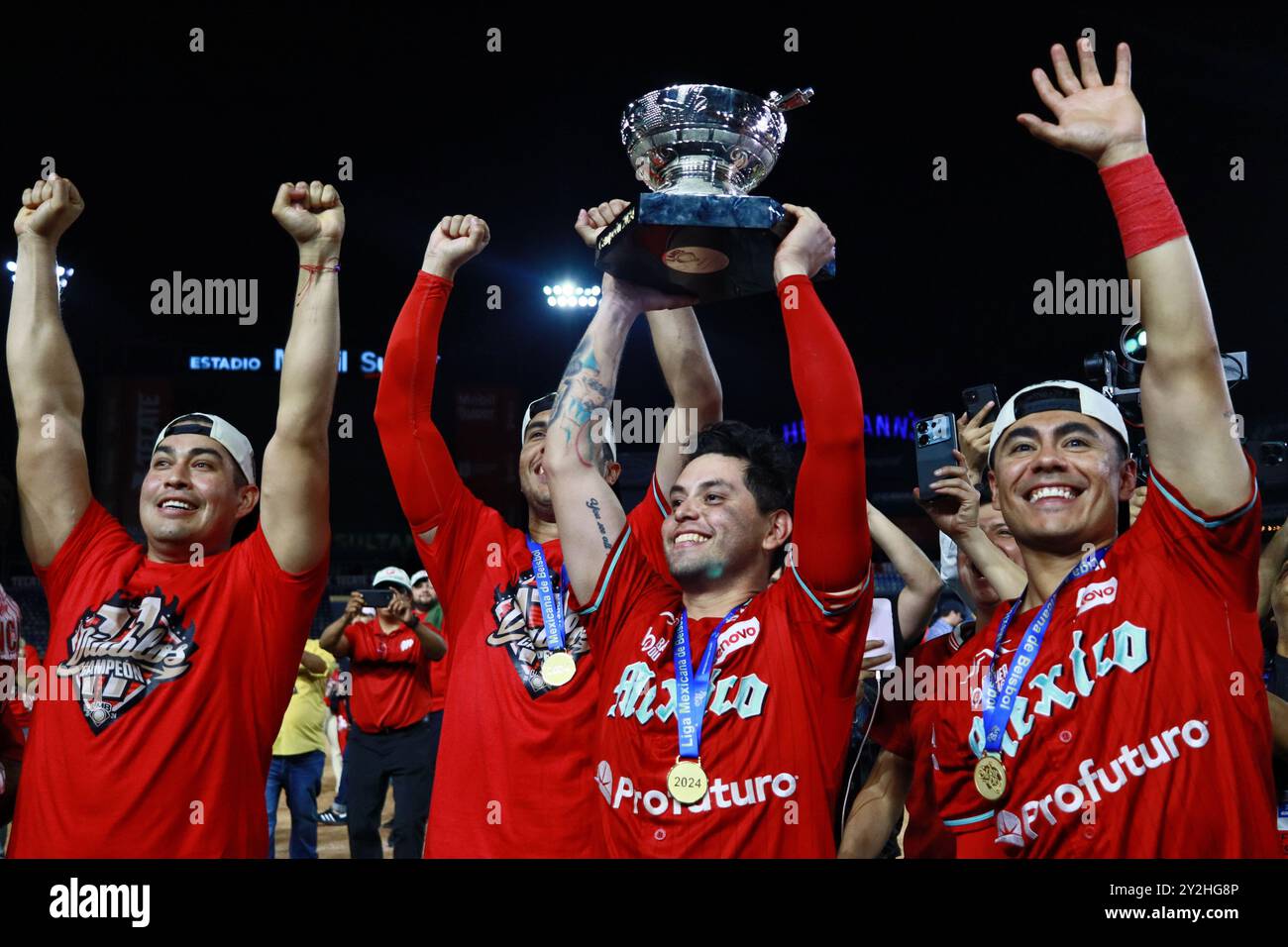 Juan Carlos Gamboa #47 of Diablos Rojos, lifts the Zaachila cup after ...