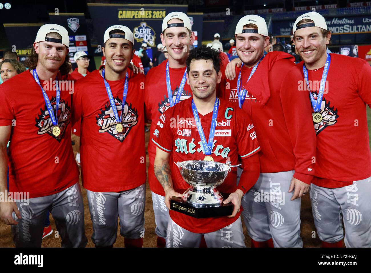 Juan Carlos Gamboa #47 of Diablos Rojos, holds the Zaachila cup after ...