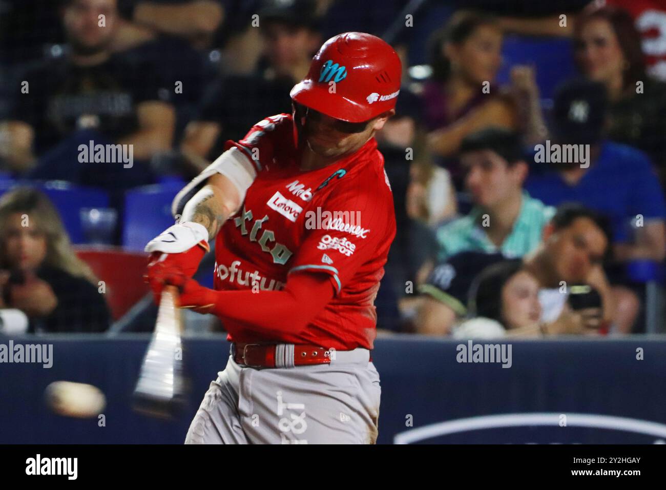 Juan Carlos Gamboa #47 of Diablos Rojos, hits the ball during the 2024 ...