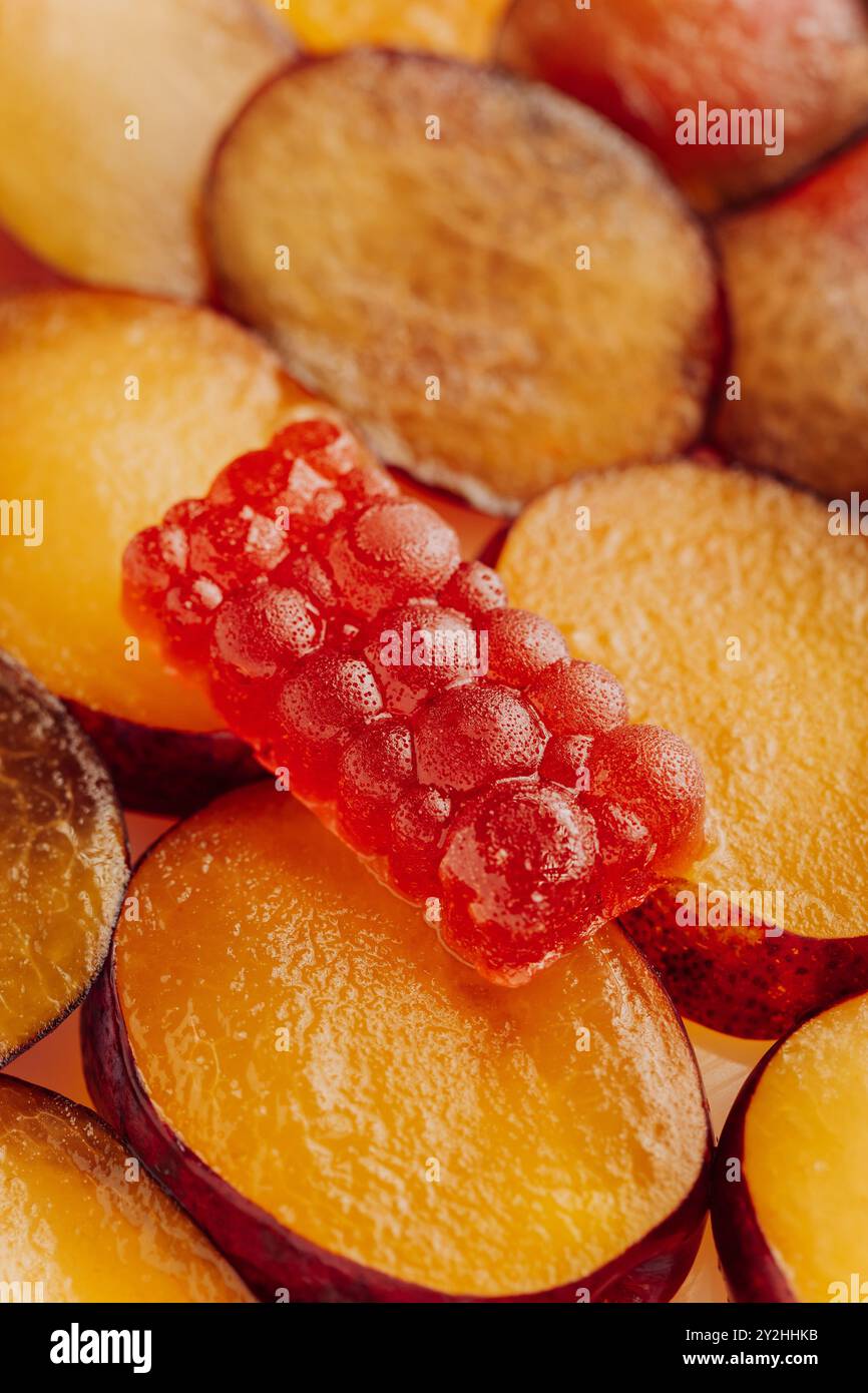 Natural plum marmalade on fresh sliced plums, vibrant color and texture ...
