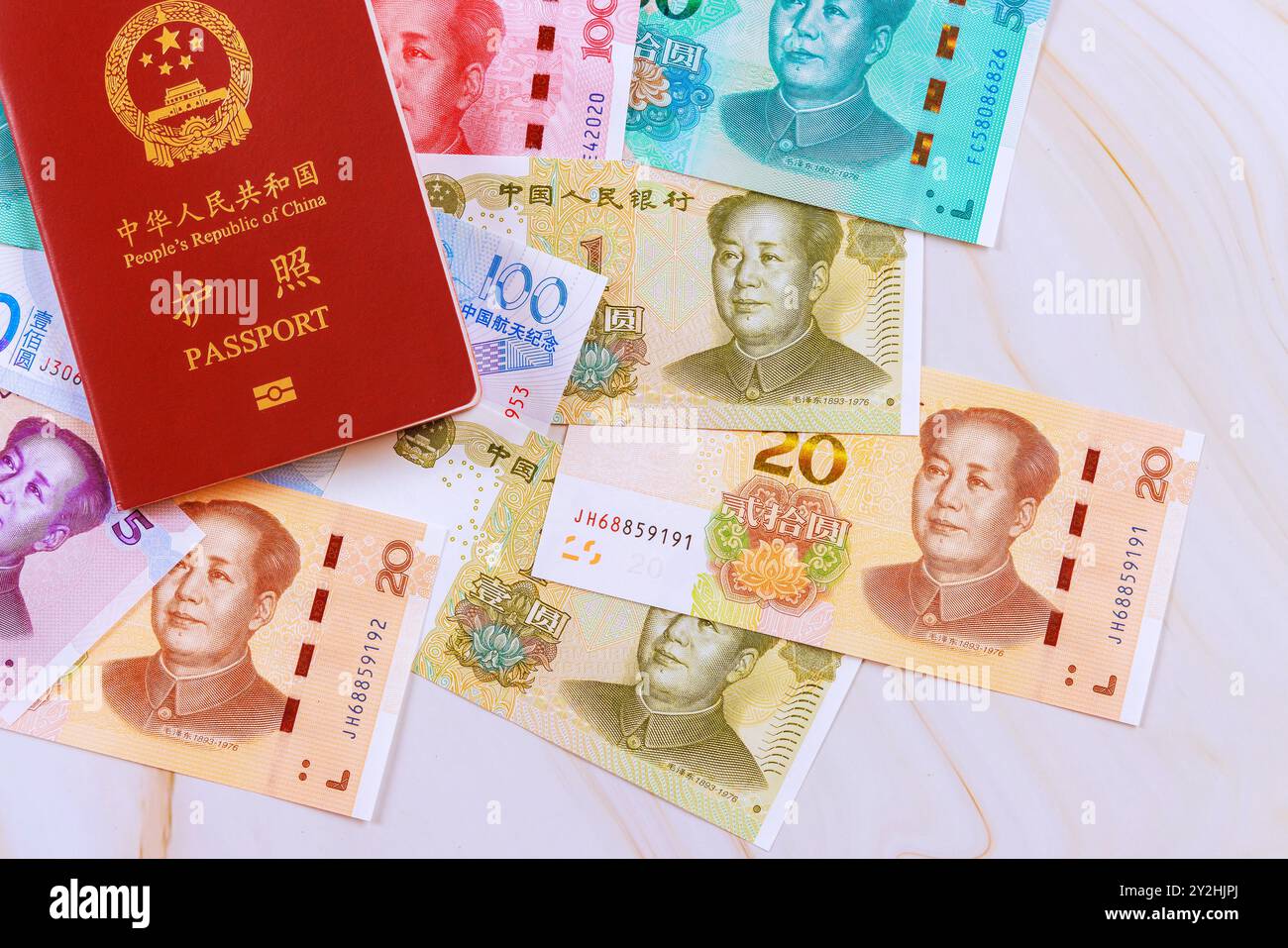 People Republic of China passport with Chinese yuan currency in various ...