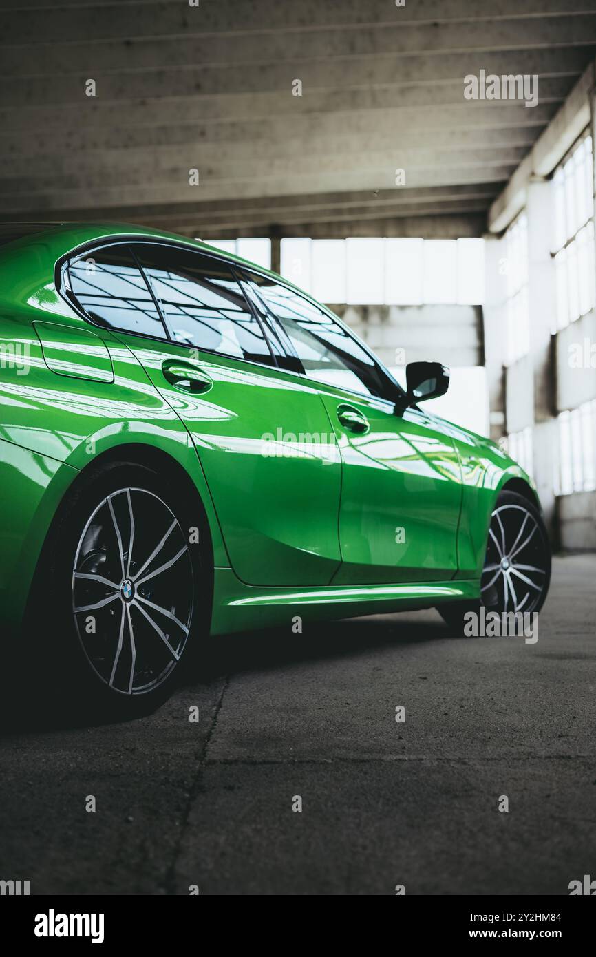 Bulgaria - 09 09 2024: Side photo of a green BMW 3 series model with ...