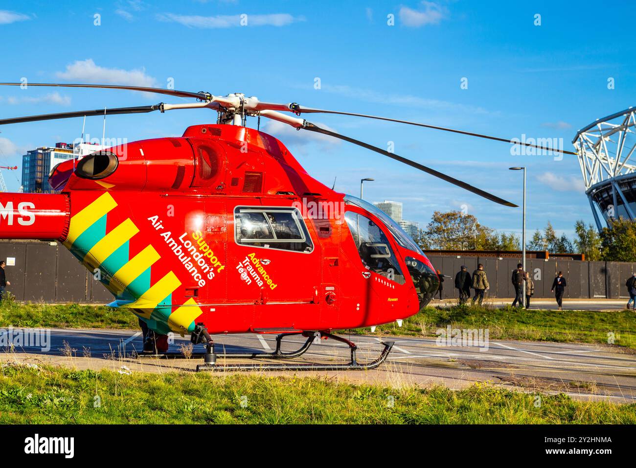 London Air Ambulance red helicopter stationed by the stadium in the Queen Elizabeth Olympic Park ...