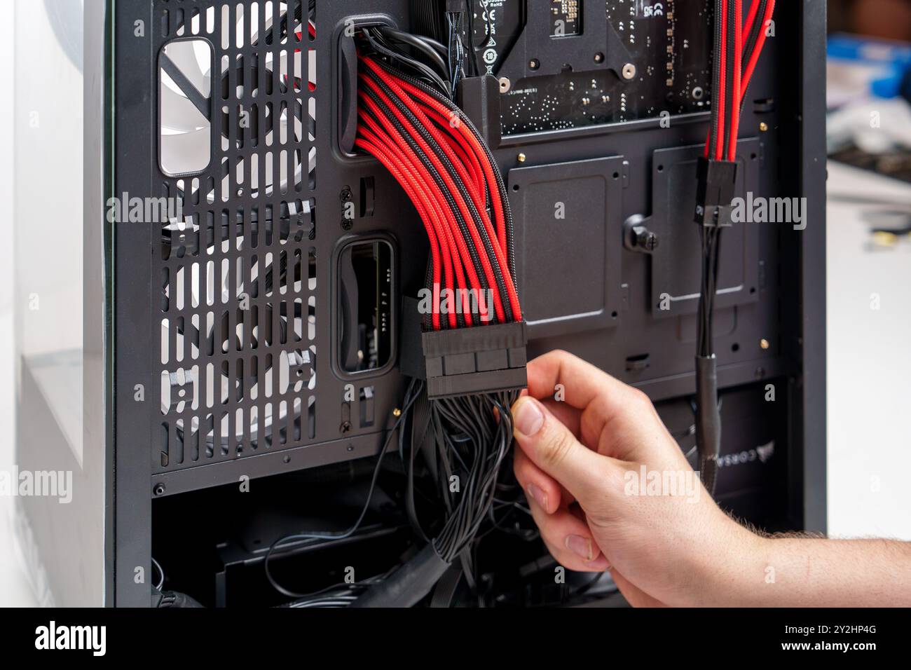 Connecting a Black ATX Power Supply Cable to an Asus Motherboard Inside ...