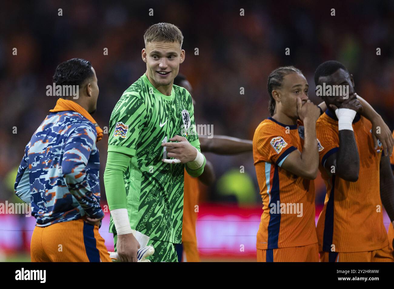 AMSTERDAM - (l-r) Holland goalkeeper Bart Verbruggen, Xavi Simons of Holland, Lutsharel ...