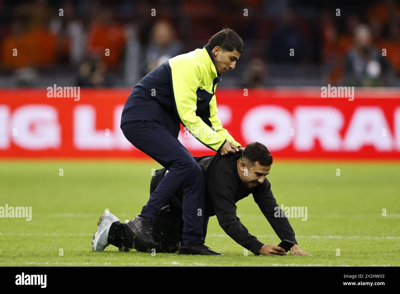 AMSTERDAM - (l-r) steward and field supervisor during the UEFA Nations ...