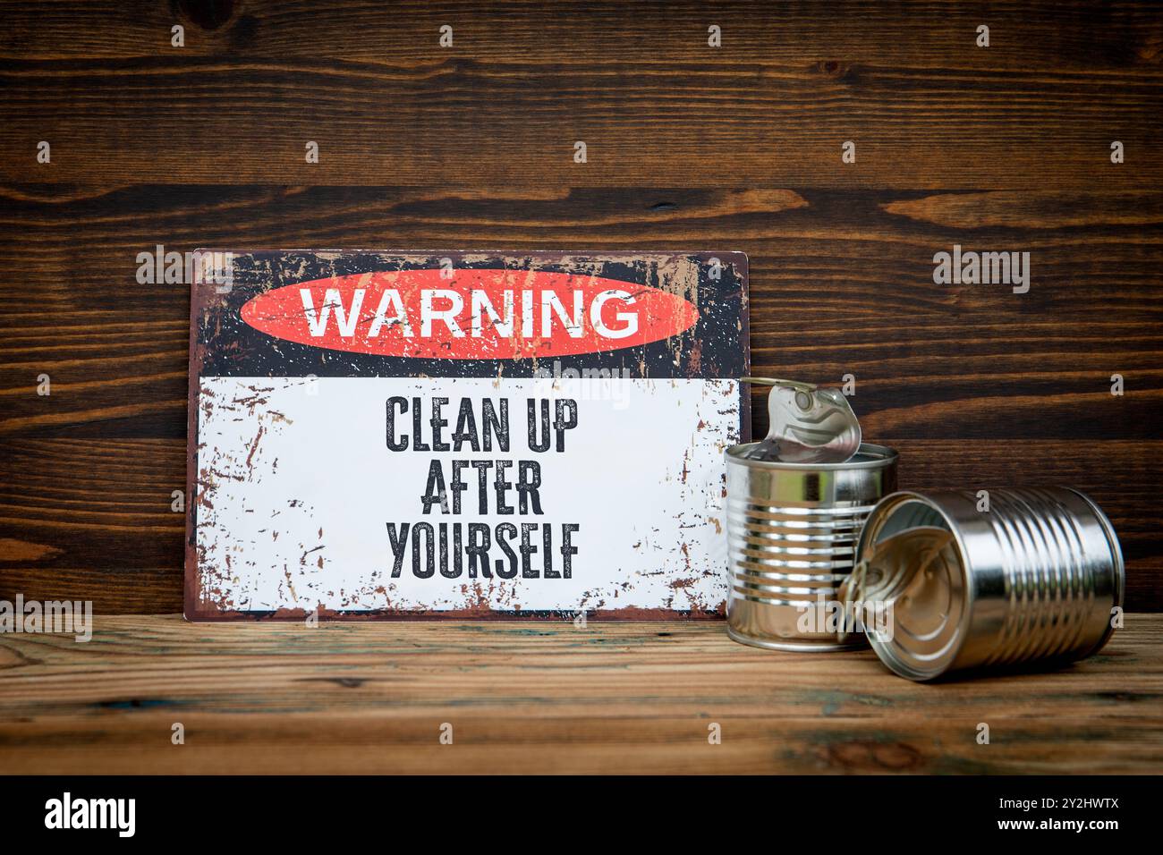 Clean up after yourself. Warning sign with text on wooden background ...