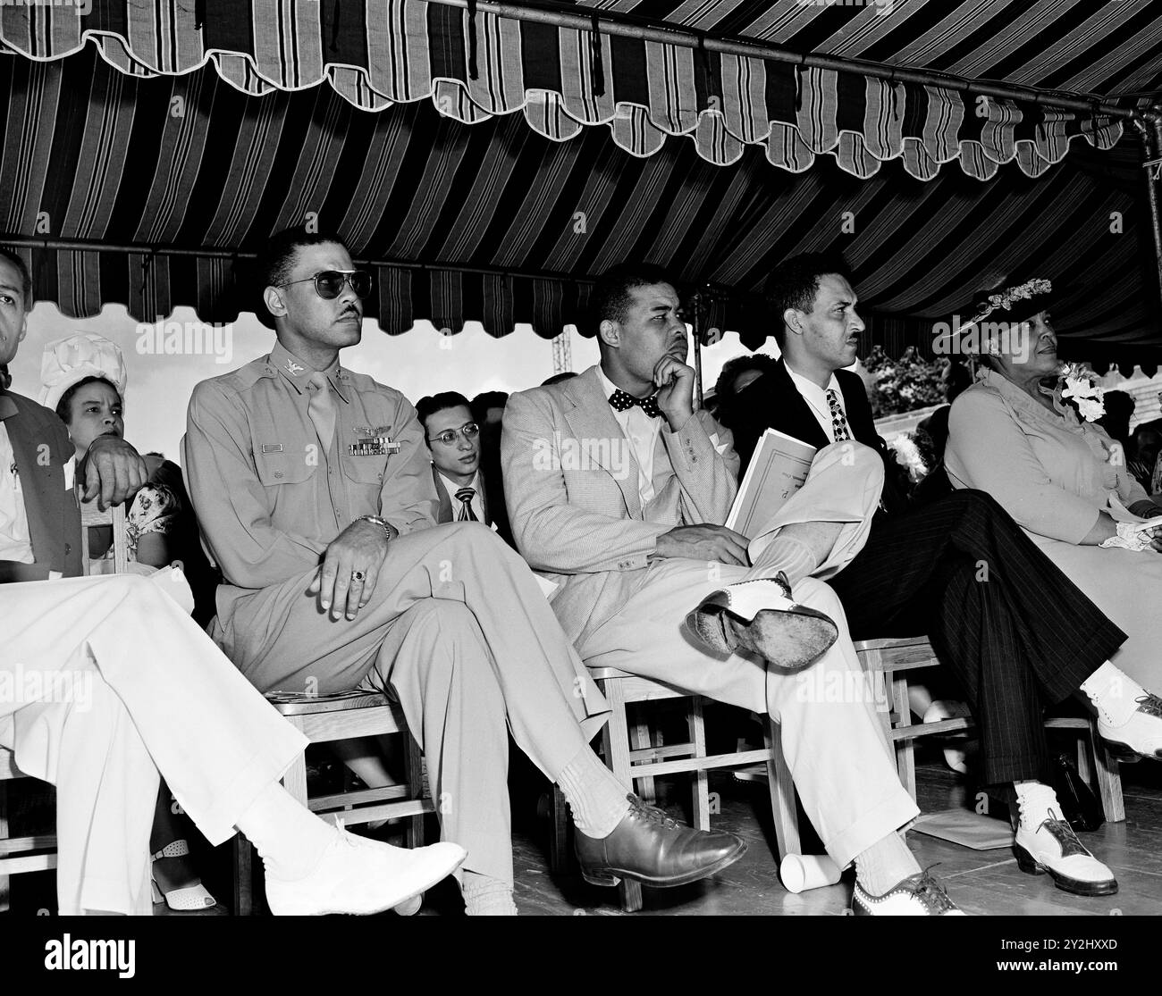 Benjamin Oliver Davis, Jr., left, with sunglasses, listens to a speaker ...