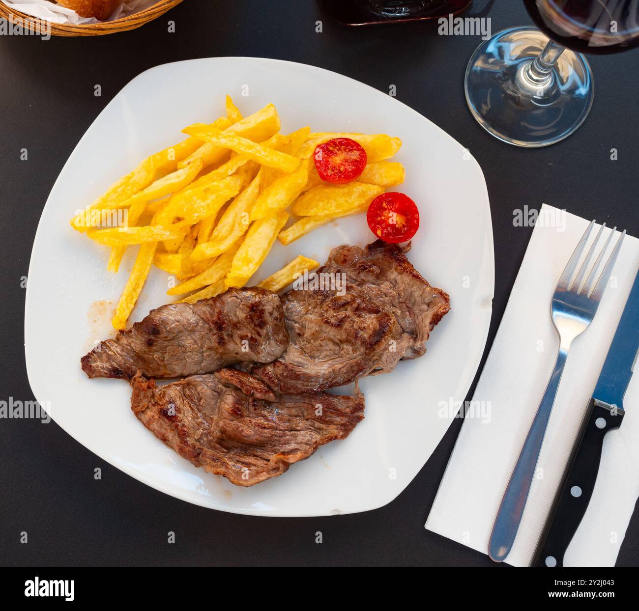 Deep-fried beef chop with French fries, served with red wine Stock ...