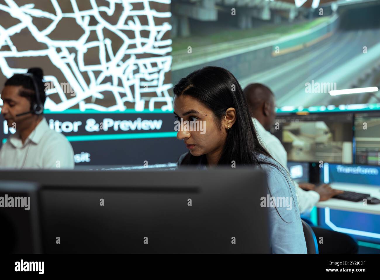 Indian employee following delivery trucks in traffic via mobile map ...