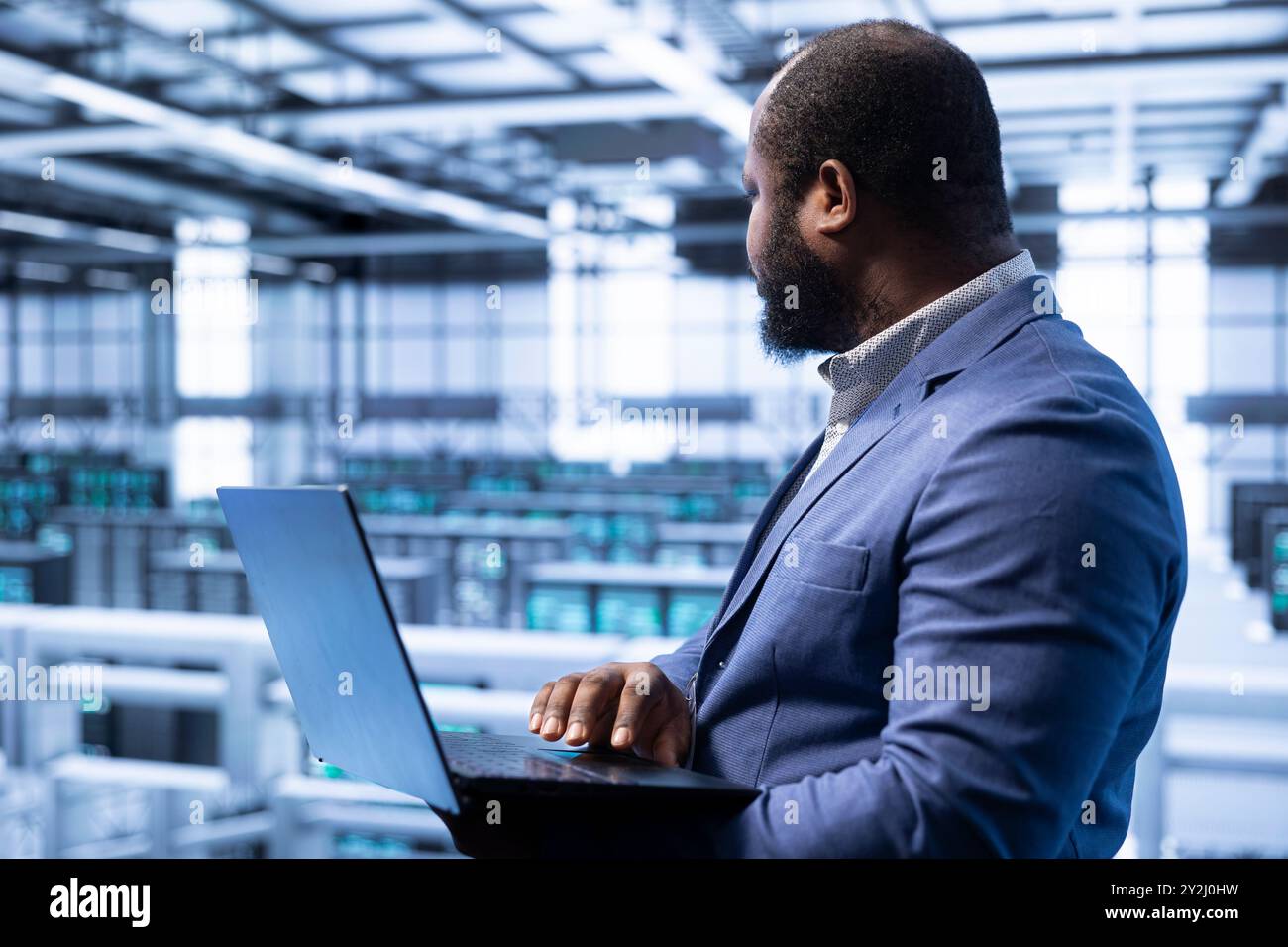 Programmer in data center implementing backup solutions to protect ...