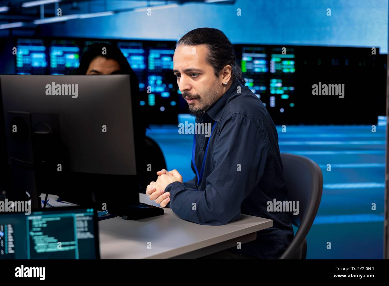 Engineer fixing vulnerabilities in software hi-res stock photography ...