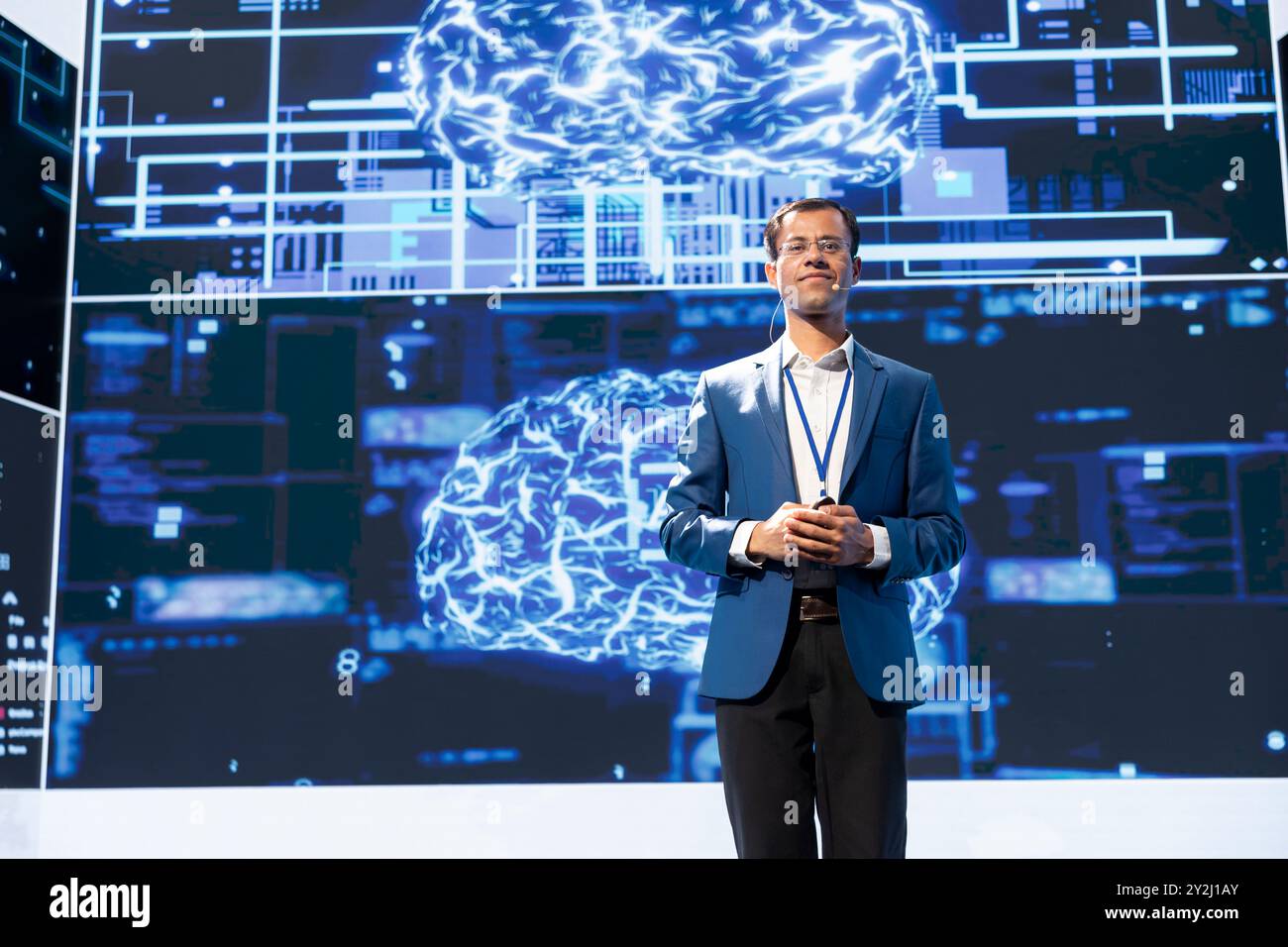 Portrait of jolly presenter speaking at tech conference, exploring ...