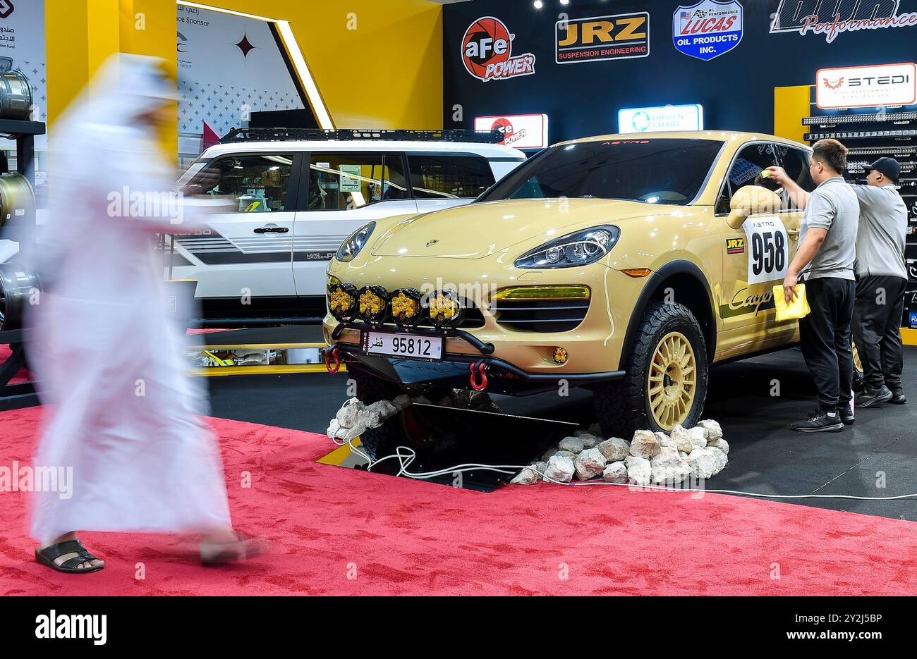 Visitors look at hunting vehicles during the 8th edition of the Katara ...