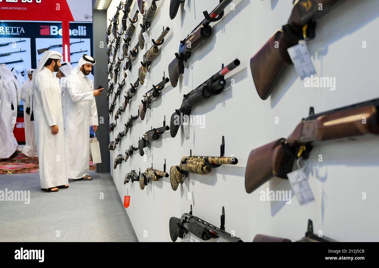Doha, Qatar. 10th Sep, 2024. People check a hunting rifle in the guns ...