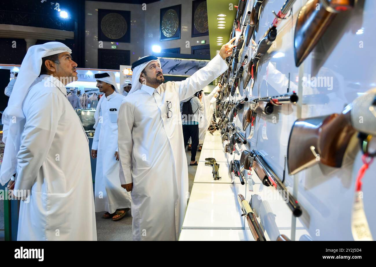 People check a hunting rifle in the guns section at the 8th edition of ...