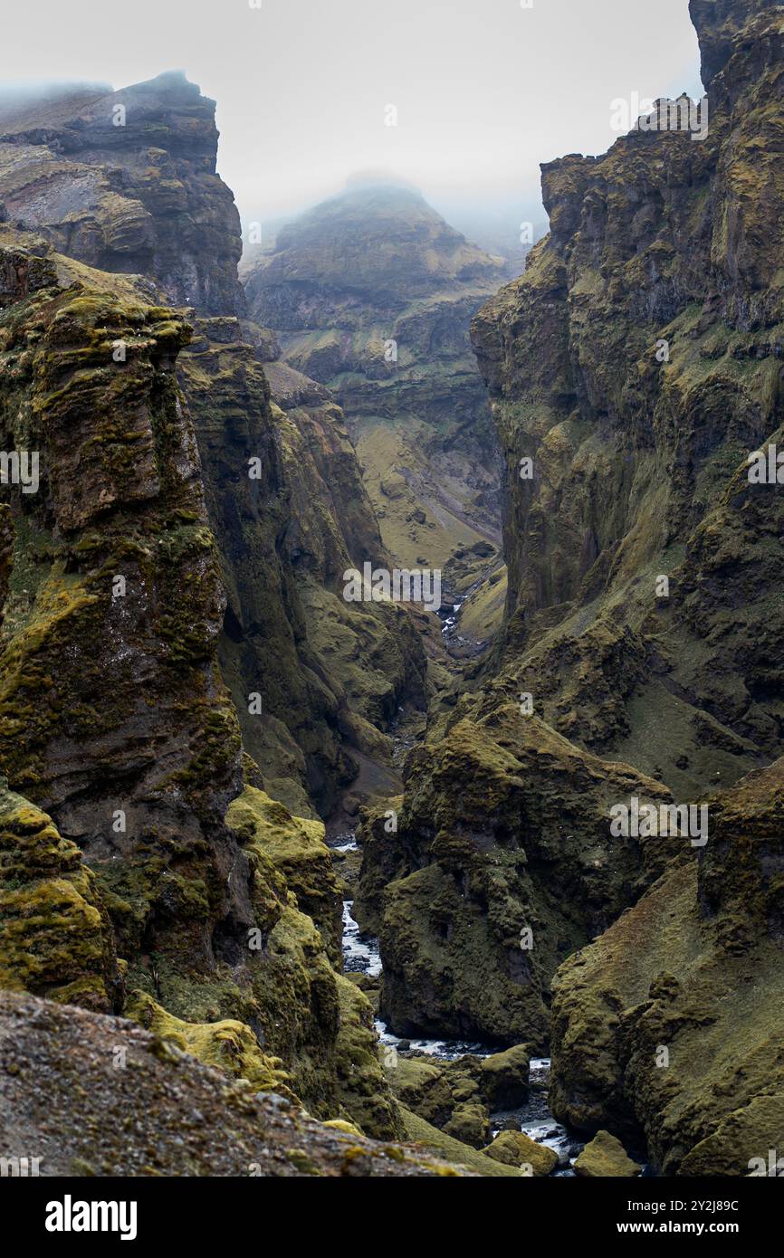 Stunning mountains with cascading waterfalls flowing through the lush ...