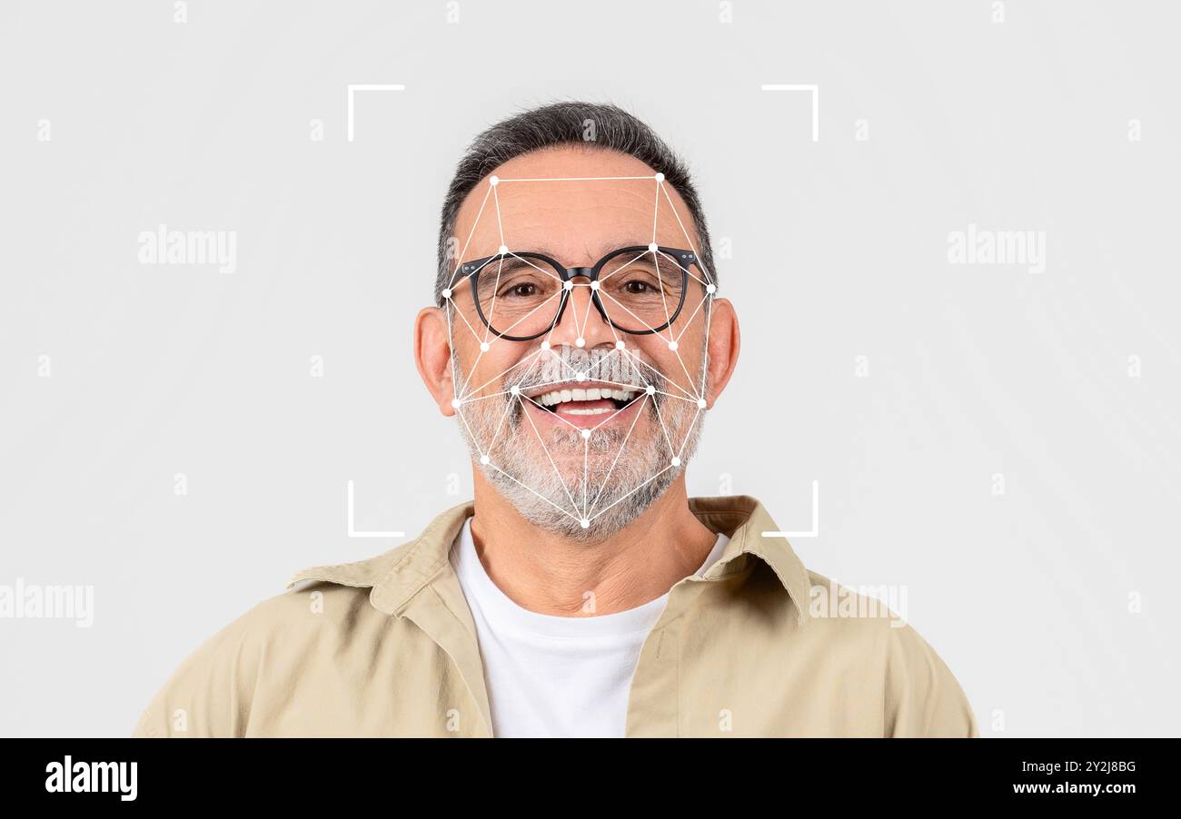 Senior man smiling with facial recognition overlay in a neutral ...
